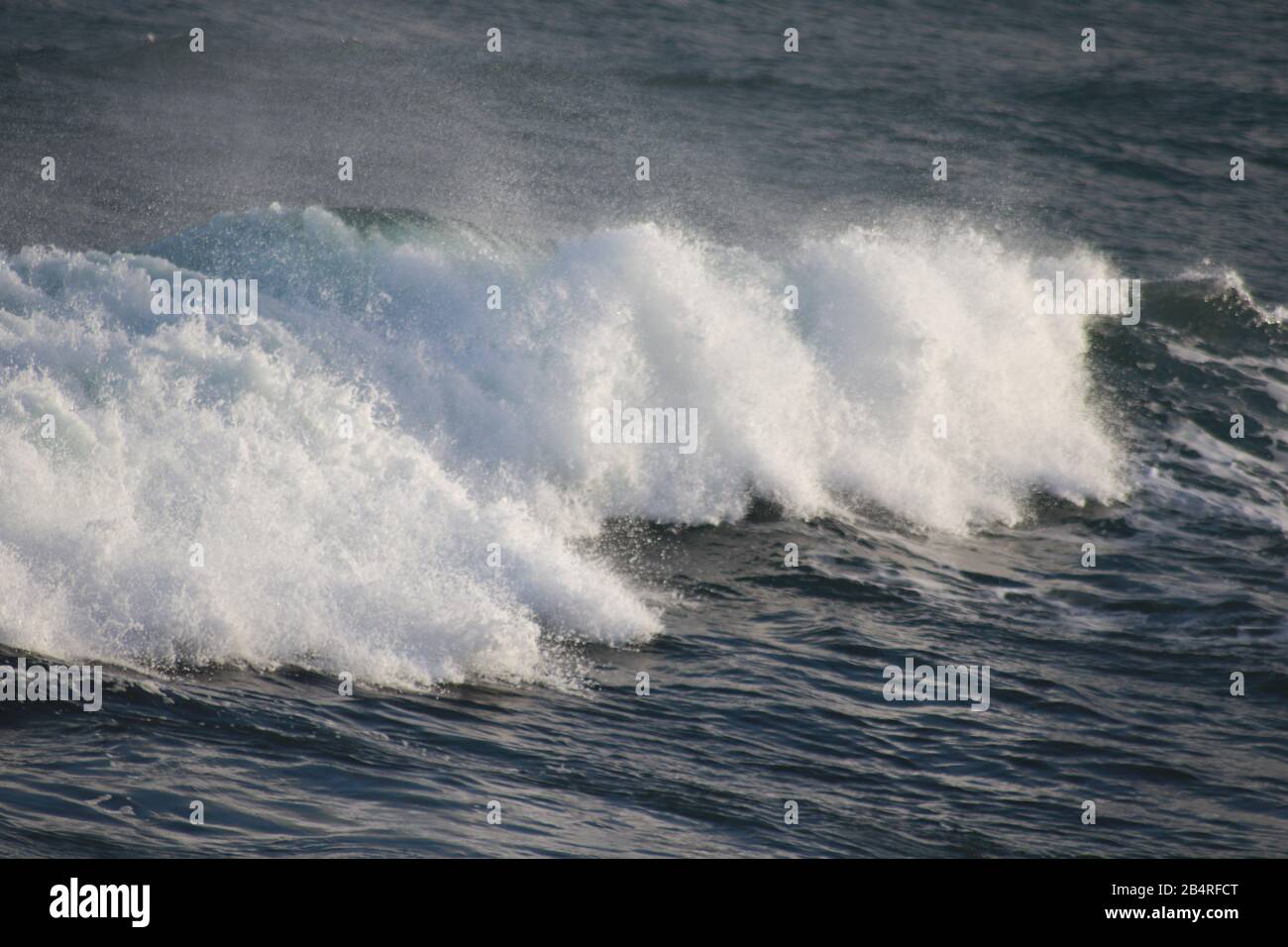 Wave breaking with surf Stock Photo - Alamy