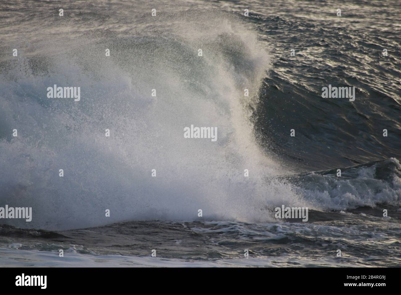 Wave breaking with surf Stock Photo - Alamy