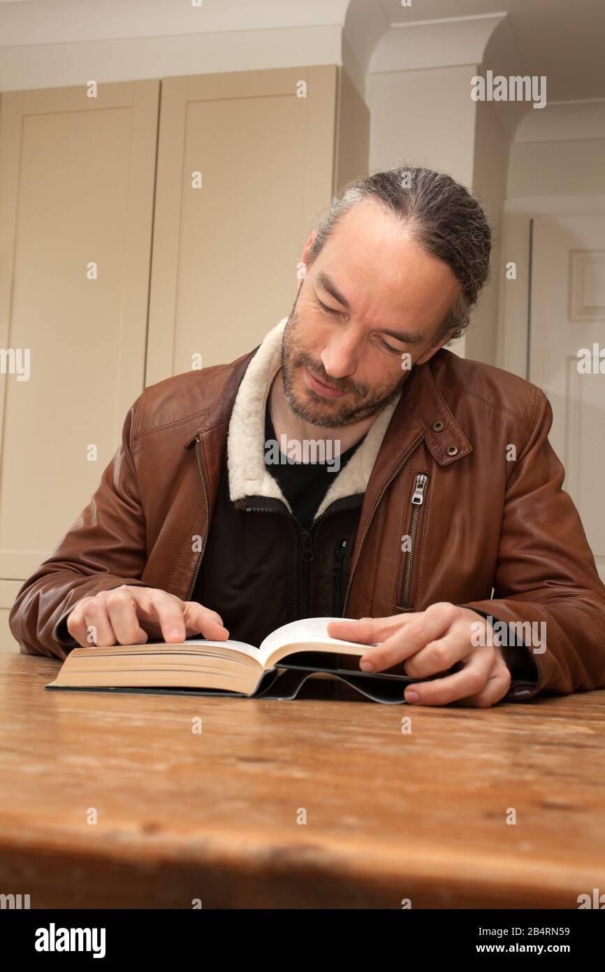 Professional man with book hi-res stock photography and images - Alamy