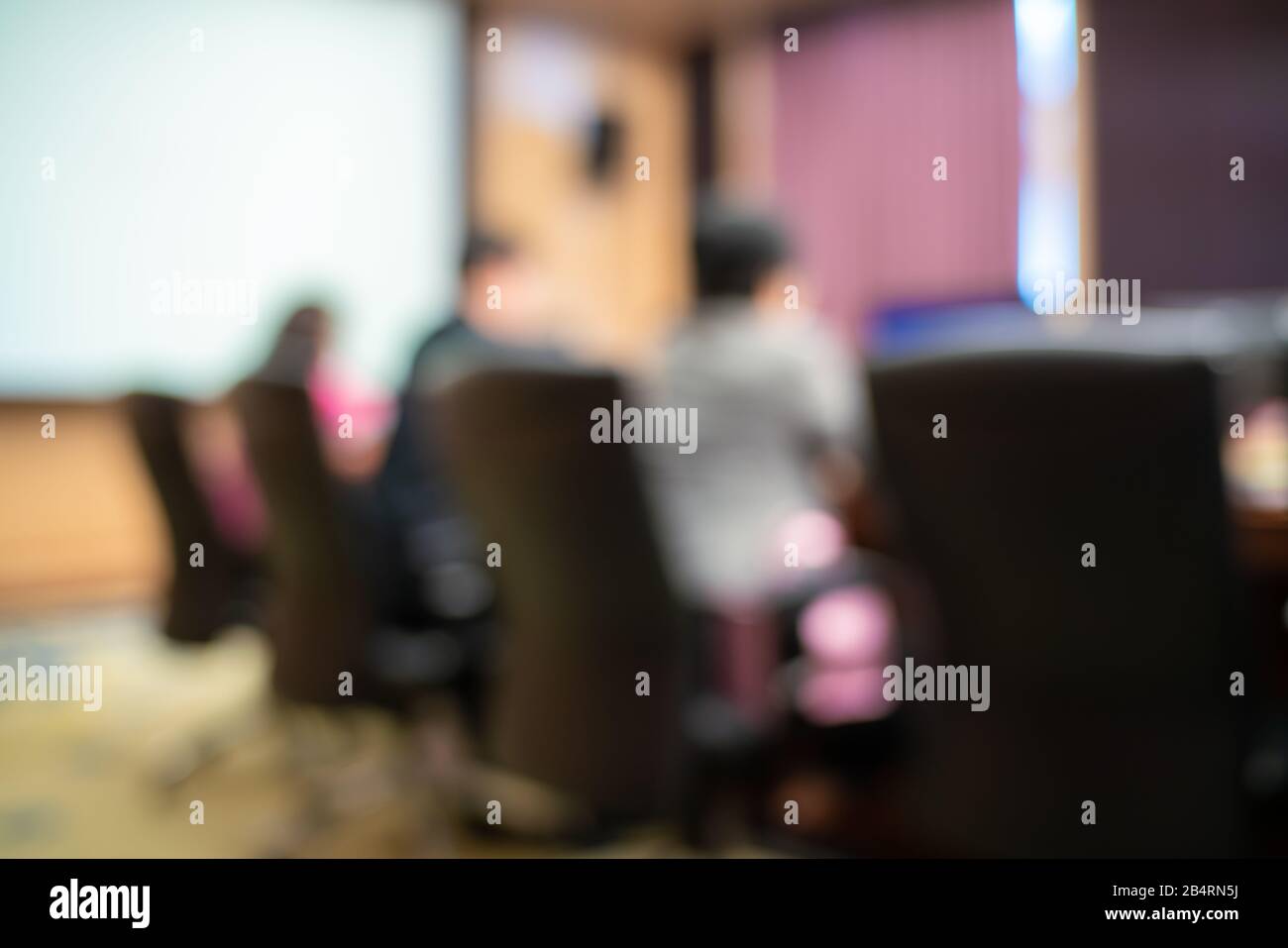 Abstract blurred people sitting in seminar conference hall room ...
