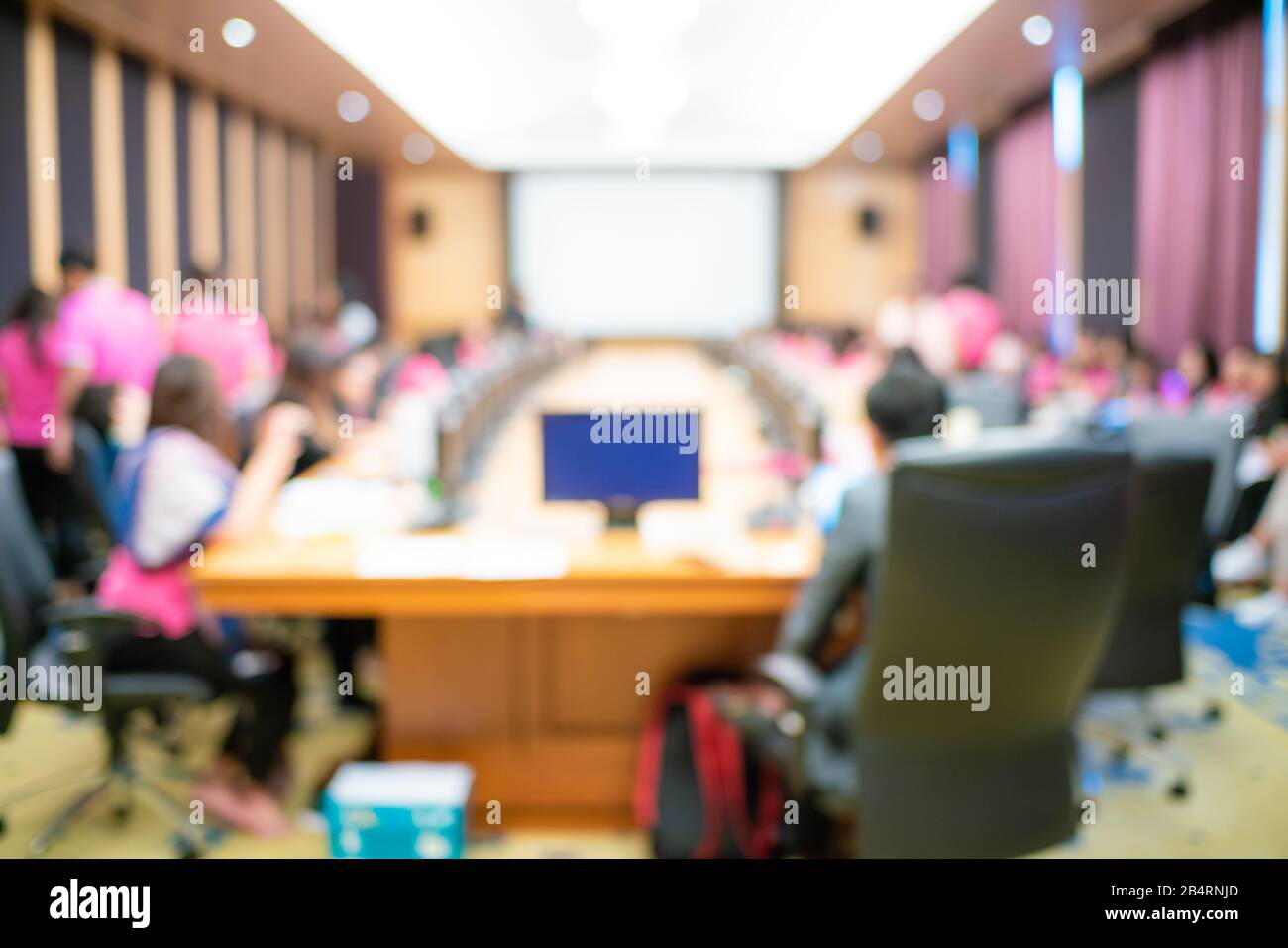 Abstract blurred people sitting in seminar conference hall room ...