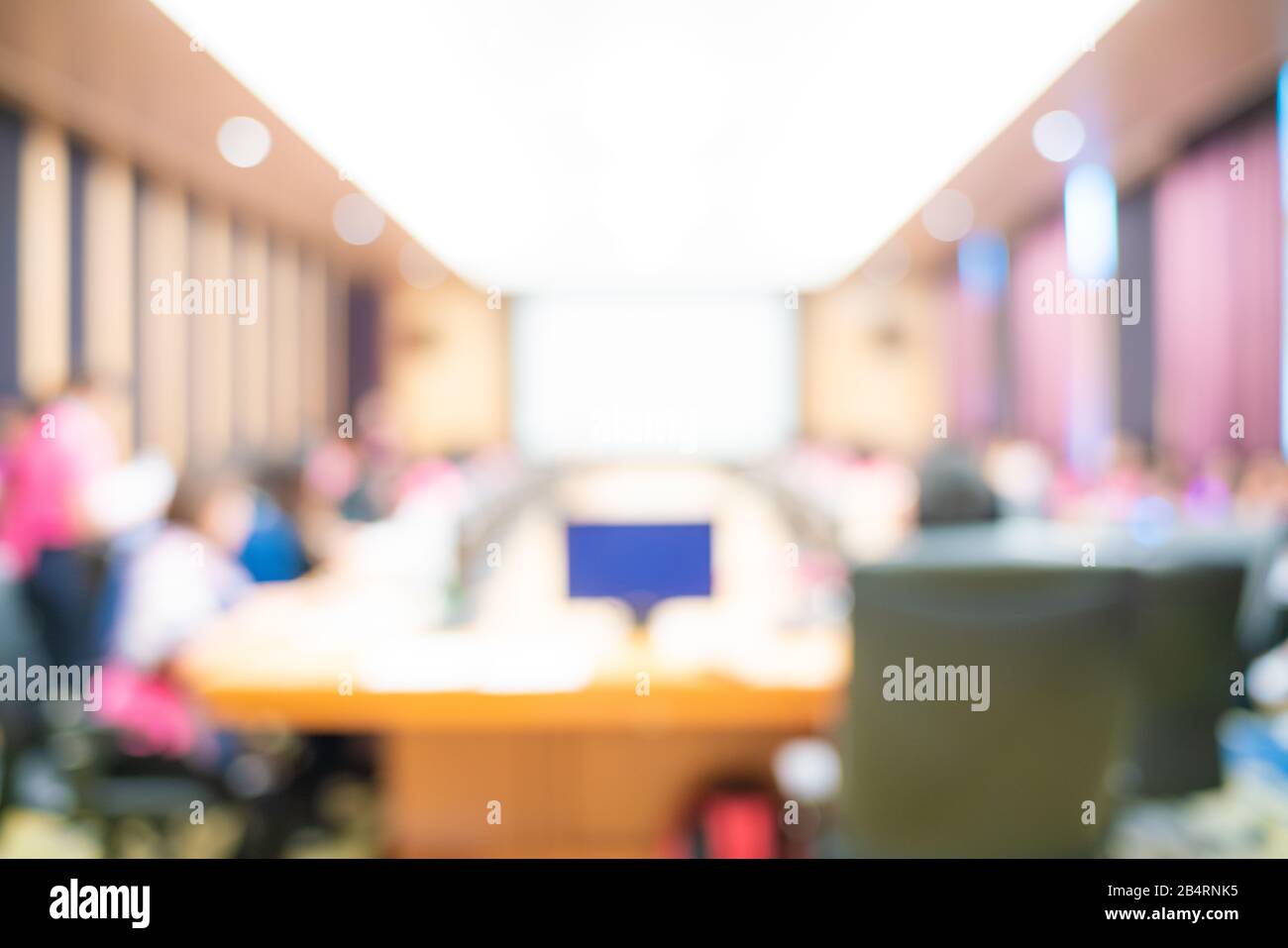 Abstract blurred people sitting in seminar conference hall room ...