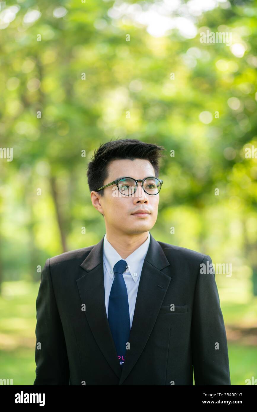 Smart business asian men with suit in green city park, Bun Stock Photo ...