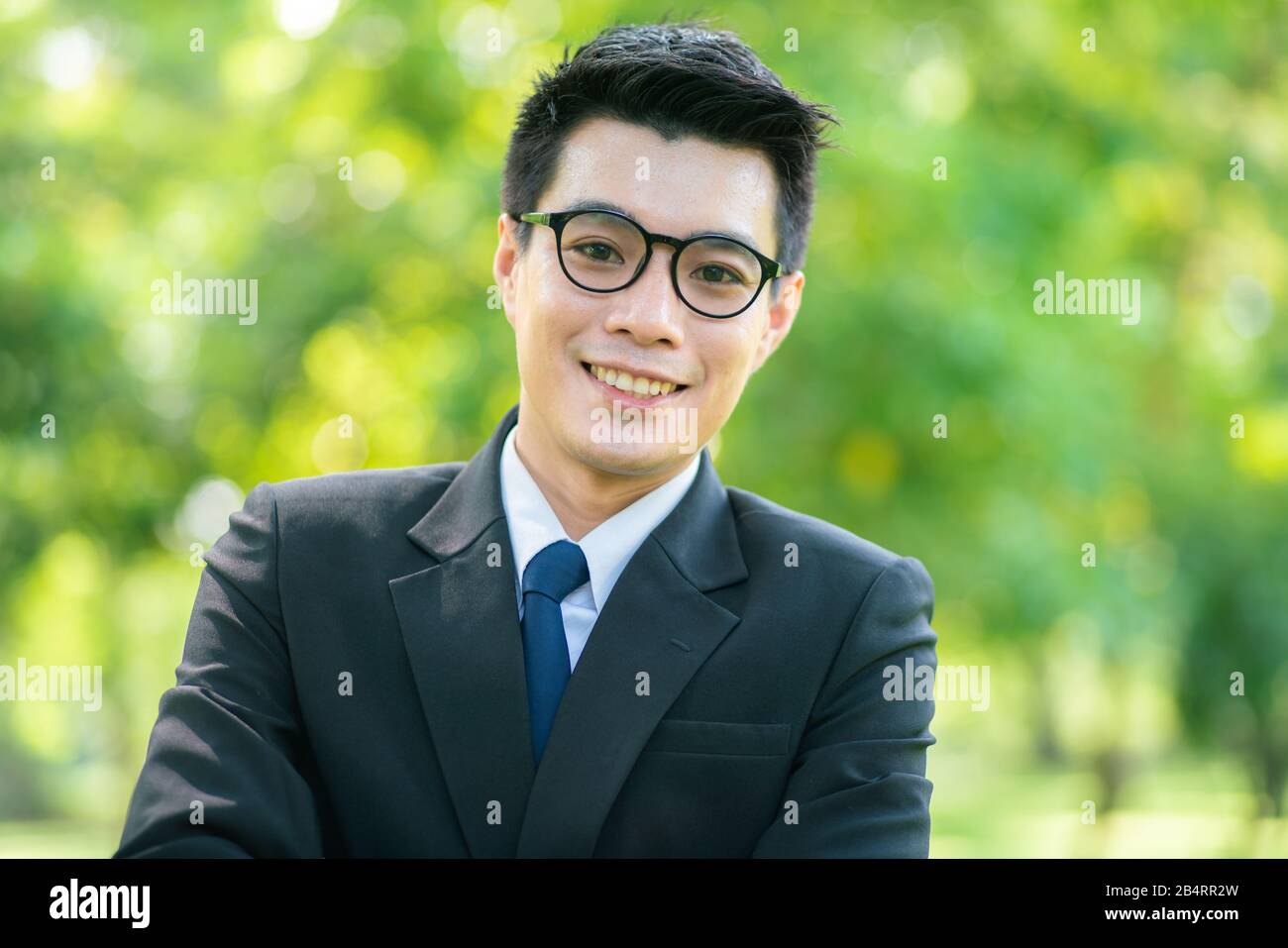Smart business asian men with suit in green city park, Bun Stock Photo ...
