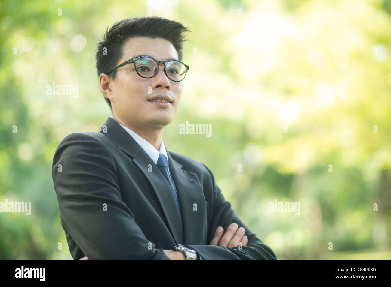 Smart business asian men with suit in green city park, Bun Stock Photo ...