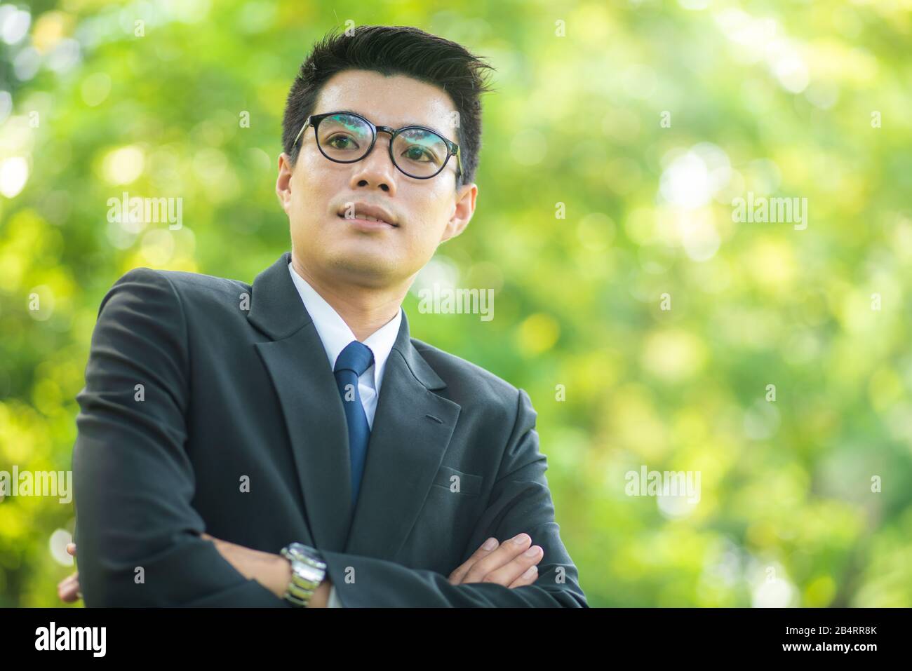 Smart business asian men with suit in green city park, Bun Stock Photo ...