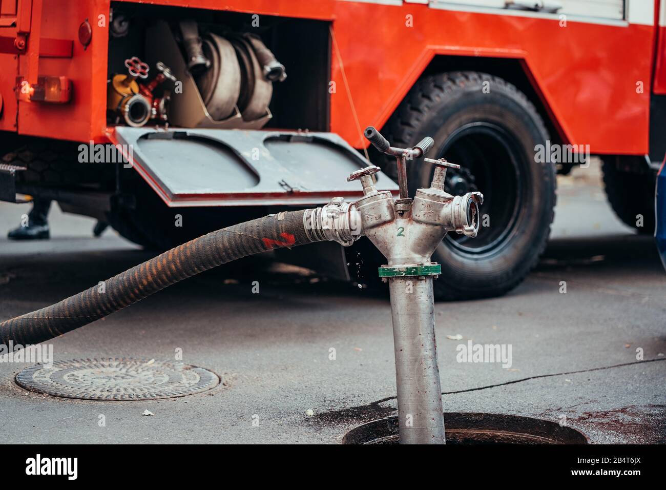 Fire Hydrant In Use During a Structure Fire Stock Photo - Alamy