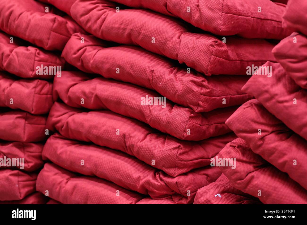 Modern red pillows standing in a stack. Close up Stock Photo - Alamy