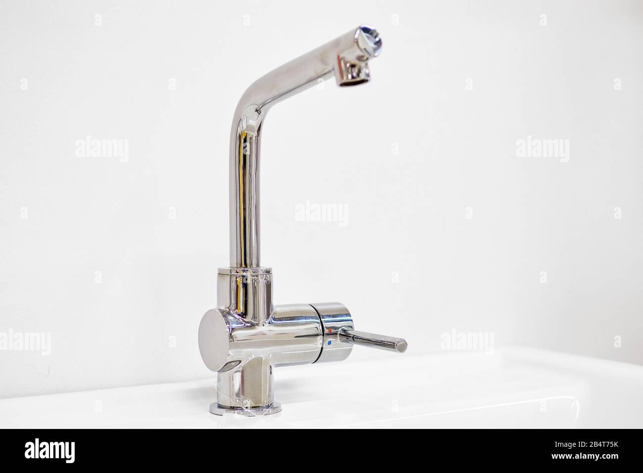 Modern metal faucet for water supply. Close up Stock Photo - Alamy