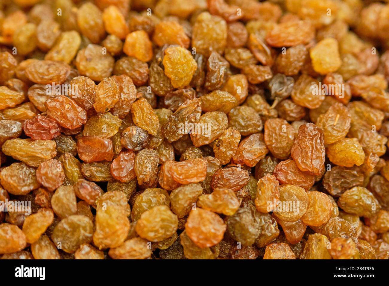 Background and texture of dry raisins. Close up Stock Photo - Alamy