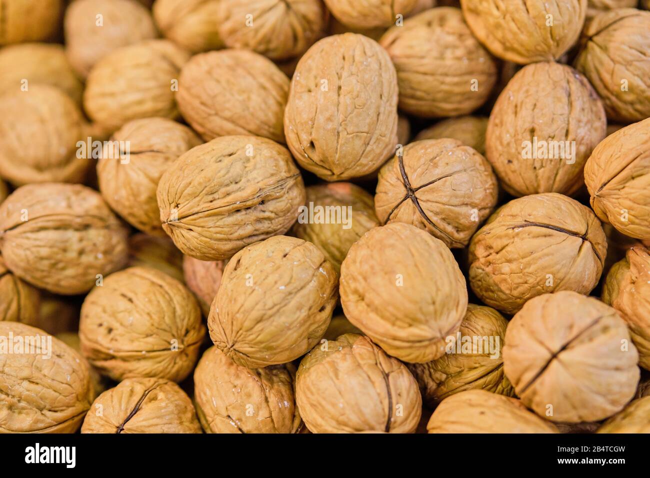 Background and texture of unpeeled walnut. Close up Stock Photo - Alamy