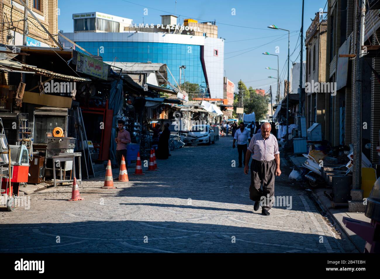 Kurdish man walking down the road in Erbil Stock Photo - Alamy
