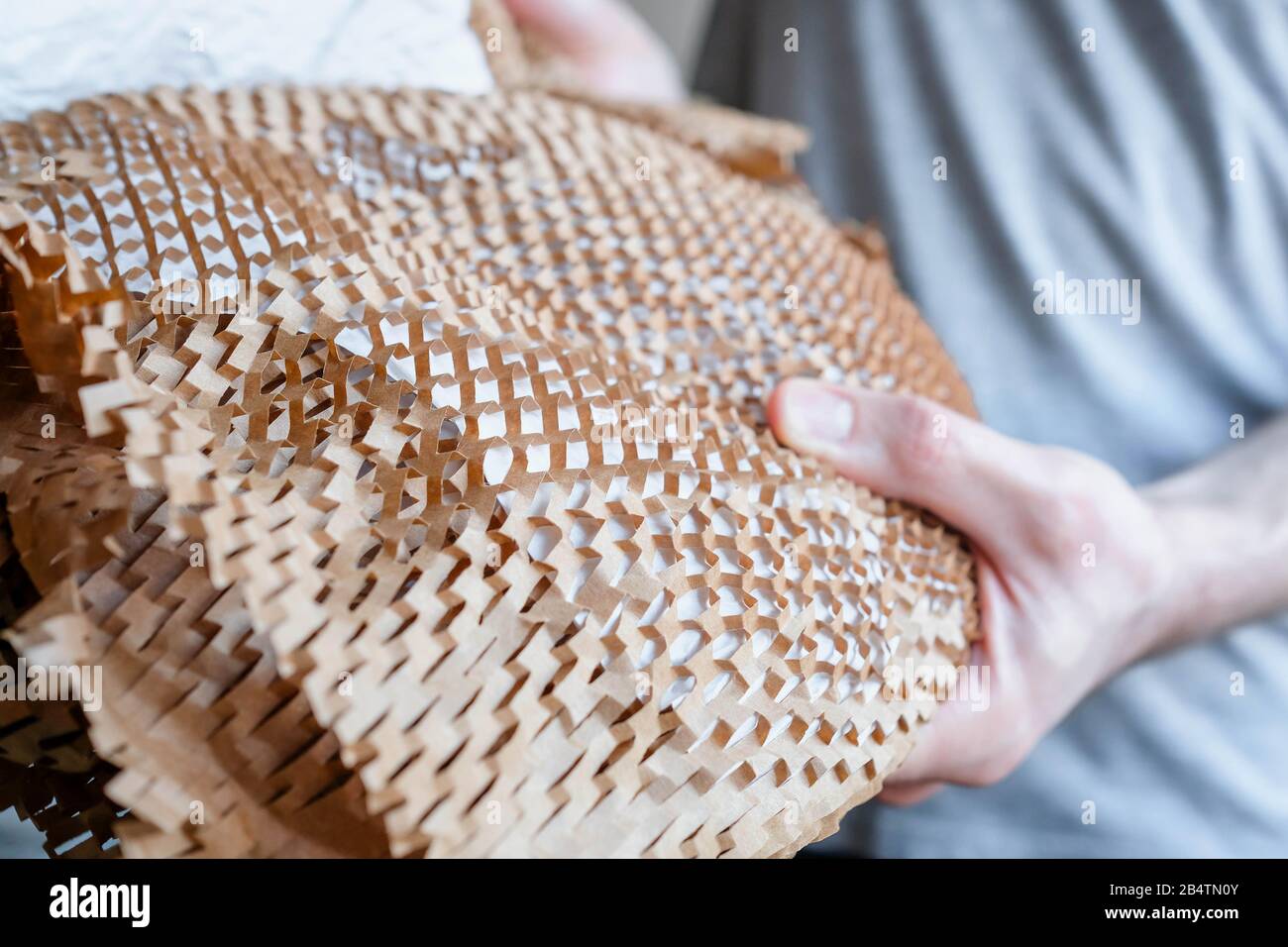 Hold a packaged fragile item. Paper packaging in the form of a grid ...