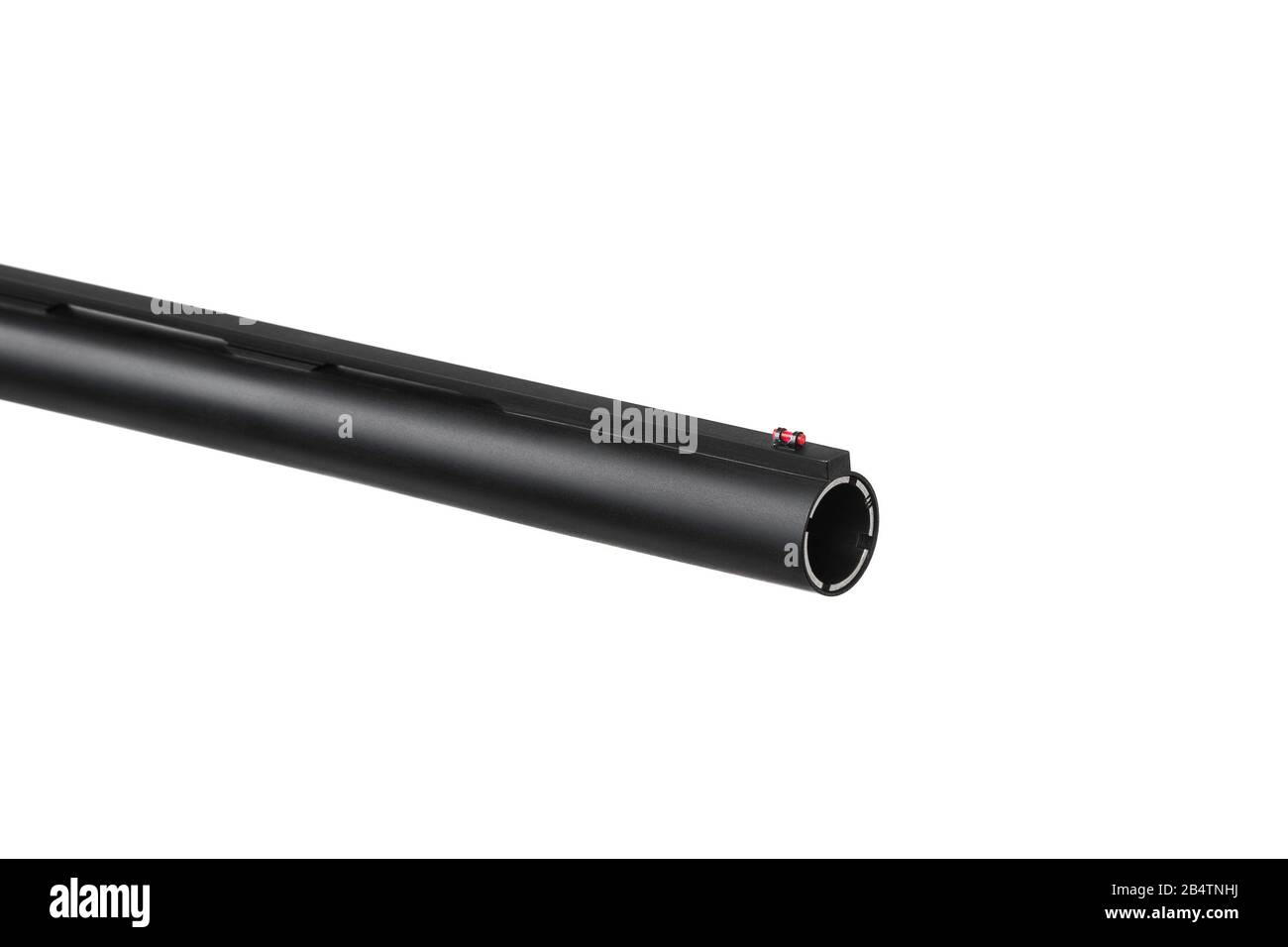 Closeup of shotgun barrel on light back. Semi-automatic shotgun with a ...