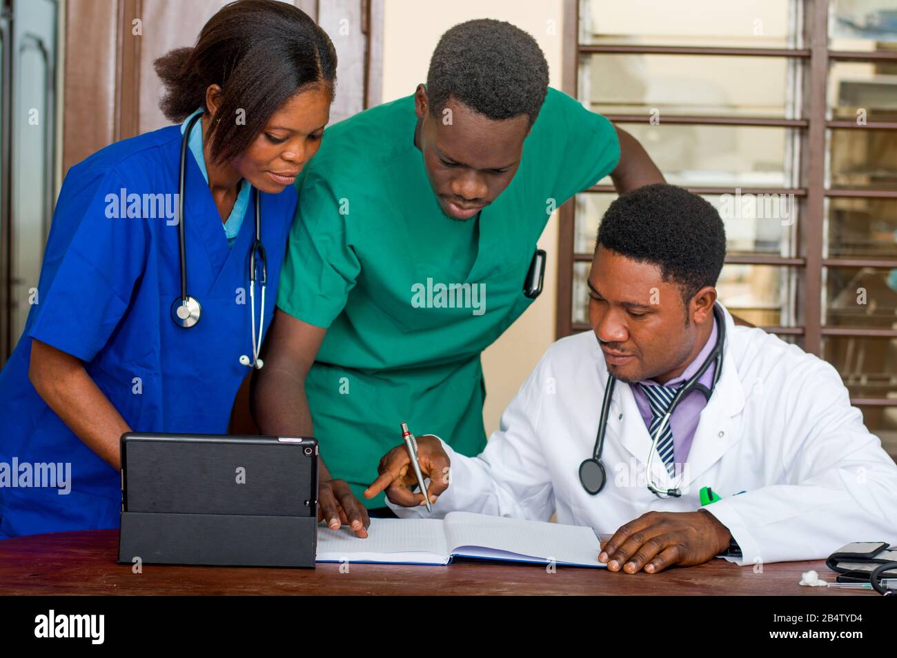 team of doctors and generalist having a conversation about the ...