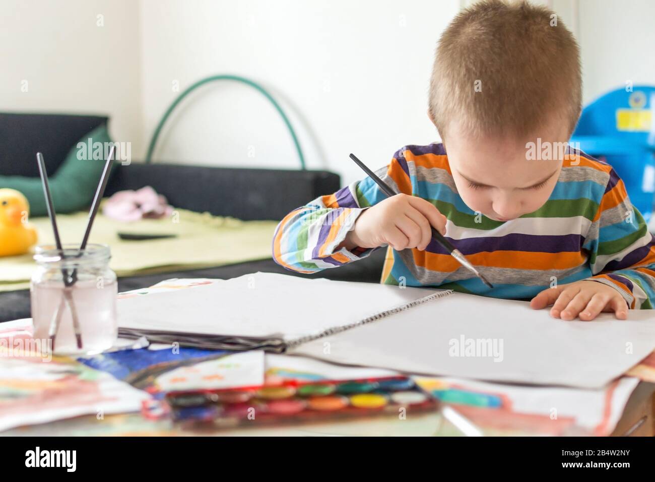 Cute boy painting and drawing at home. Children's creativity Stock ...