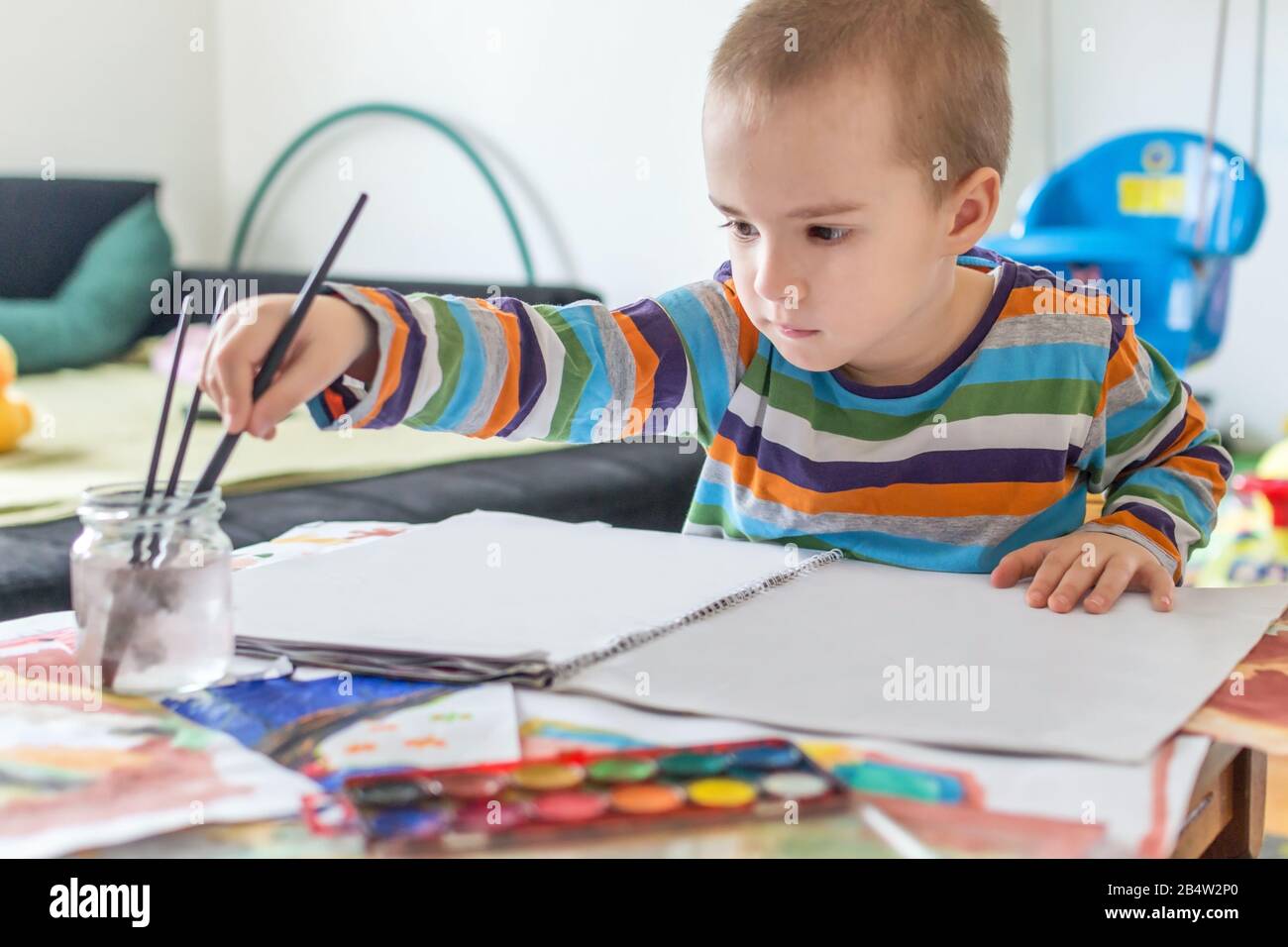 Cute boy painting and drawing at home. Children's creativity Stock ...