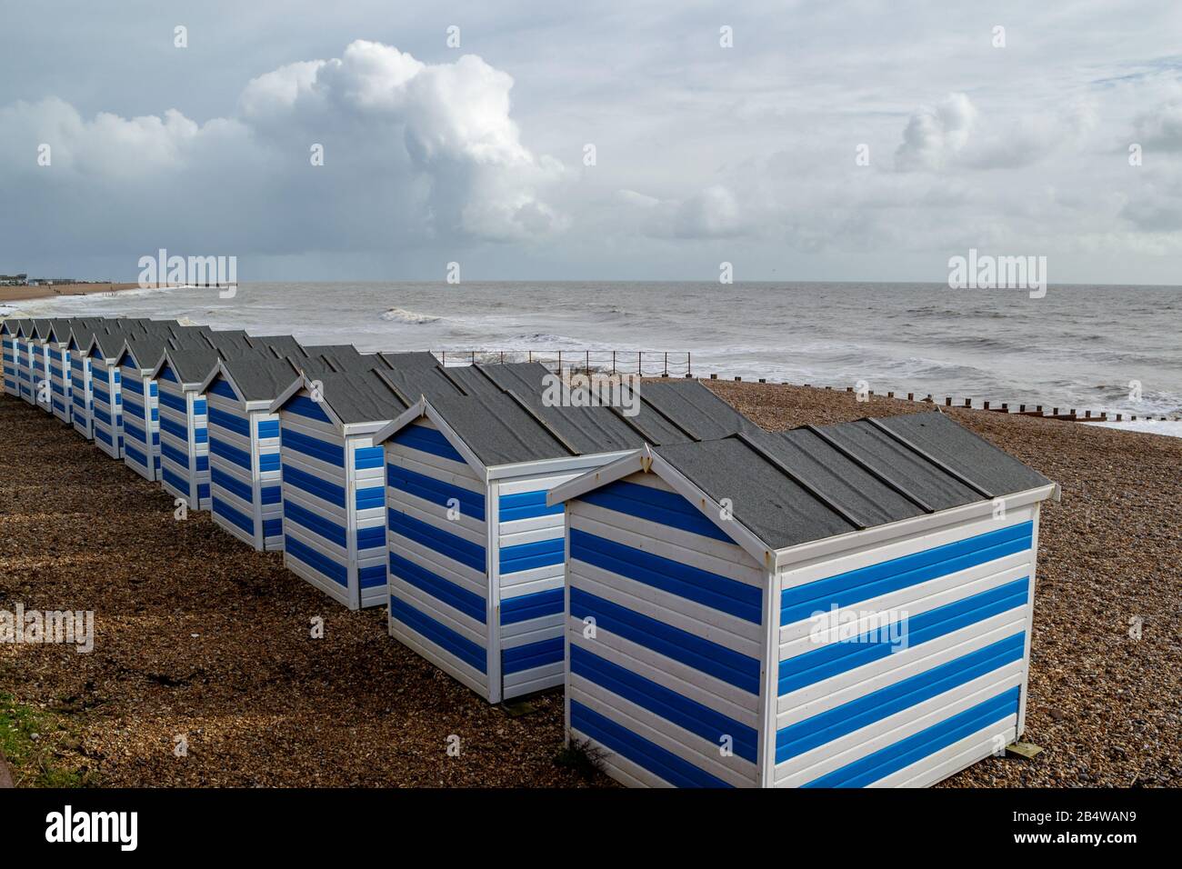 Blue and white beach huts on Hastings beach in winter Stock Photo - Alamy