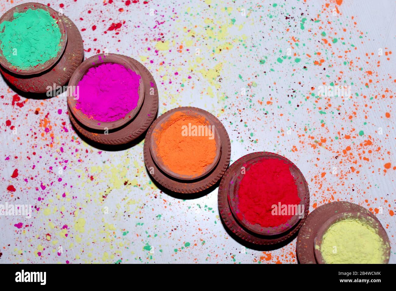 colorful traditional holi powder in bowls, Organic Gulal colors for ...