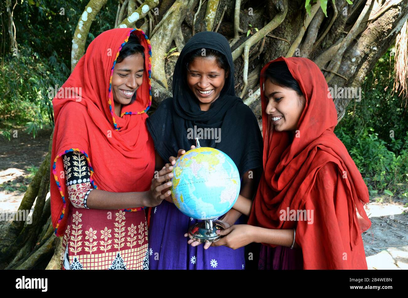 Rural Education - Three young girl learning about World Globe Map Stock ...