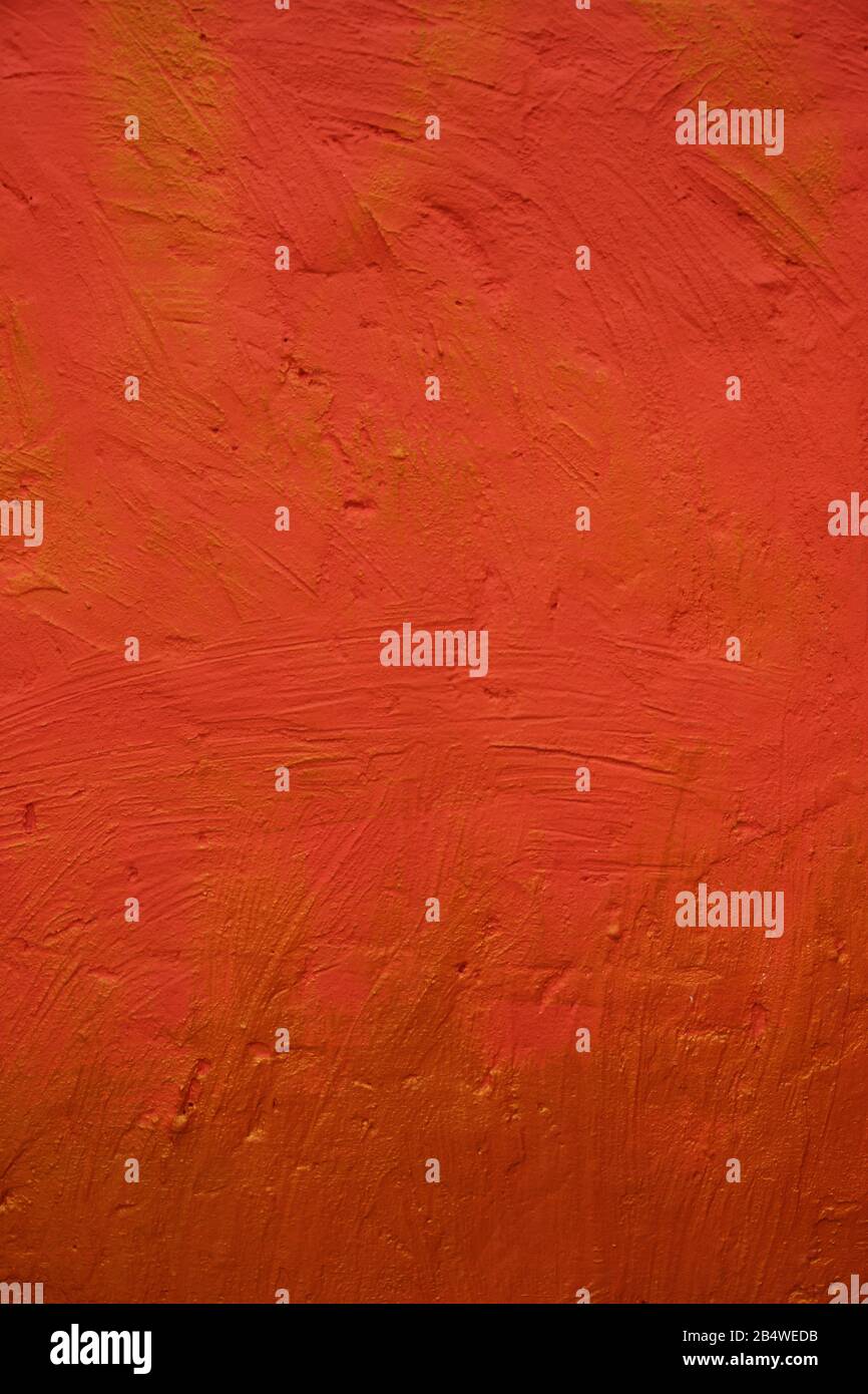 Textured red - yellow stone wall. Texture wallpaper Stock Photo - Alamy