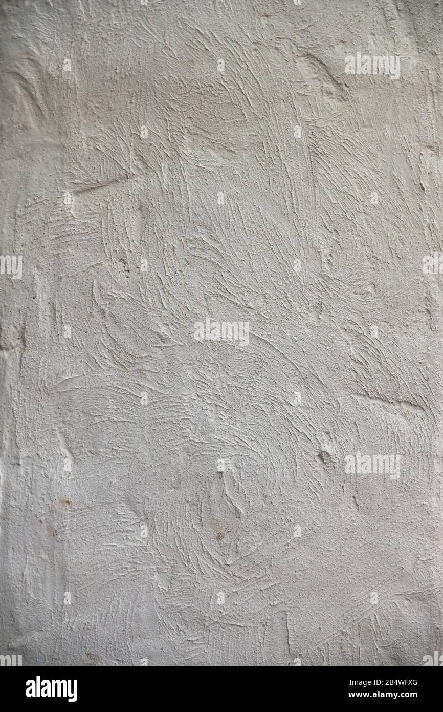 Roughly treated white putty wall with furrows. Texture wallpaper Stock ...