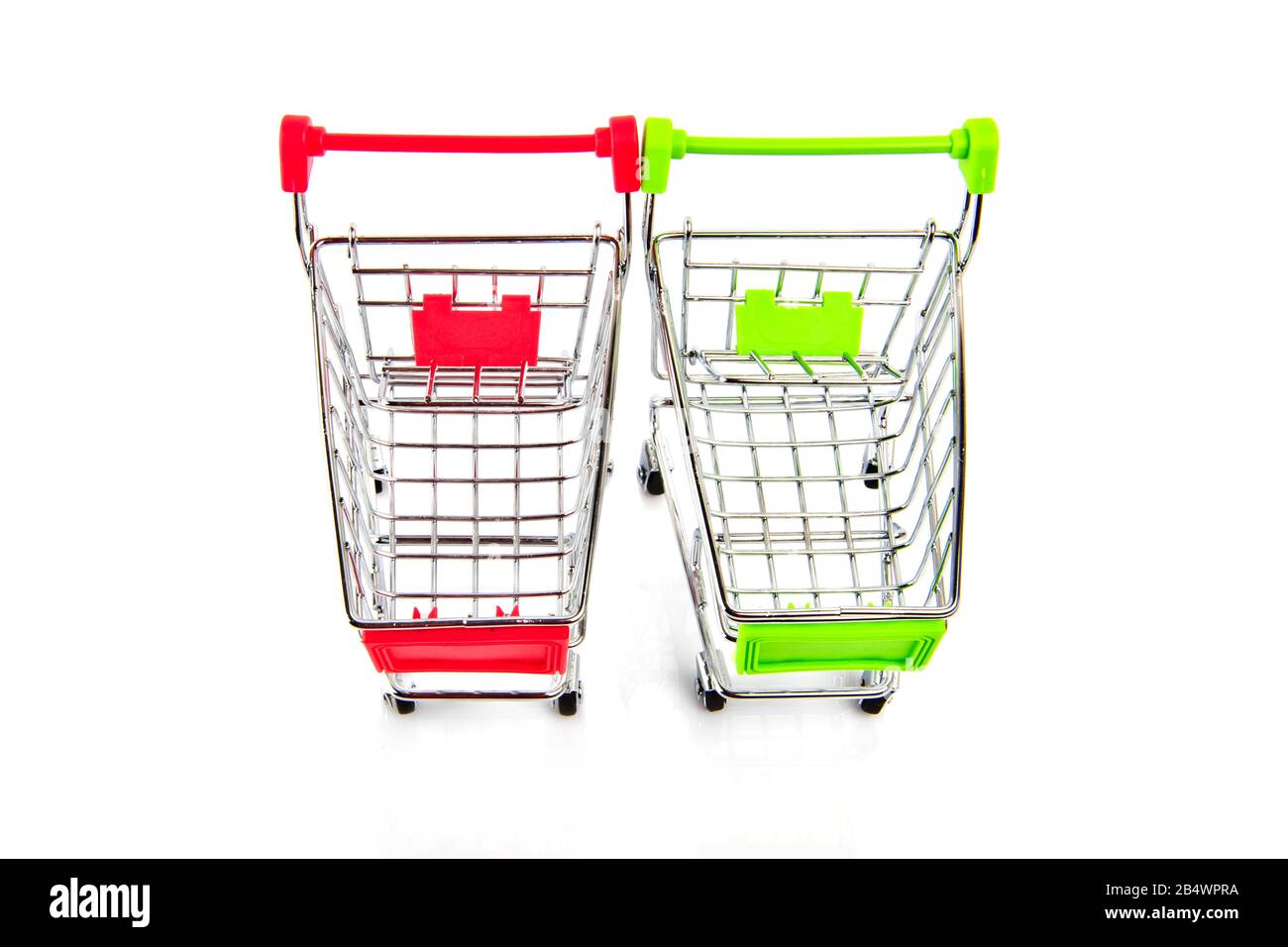 Two empty red and green shopping cart isolated on white background ...