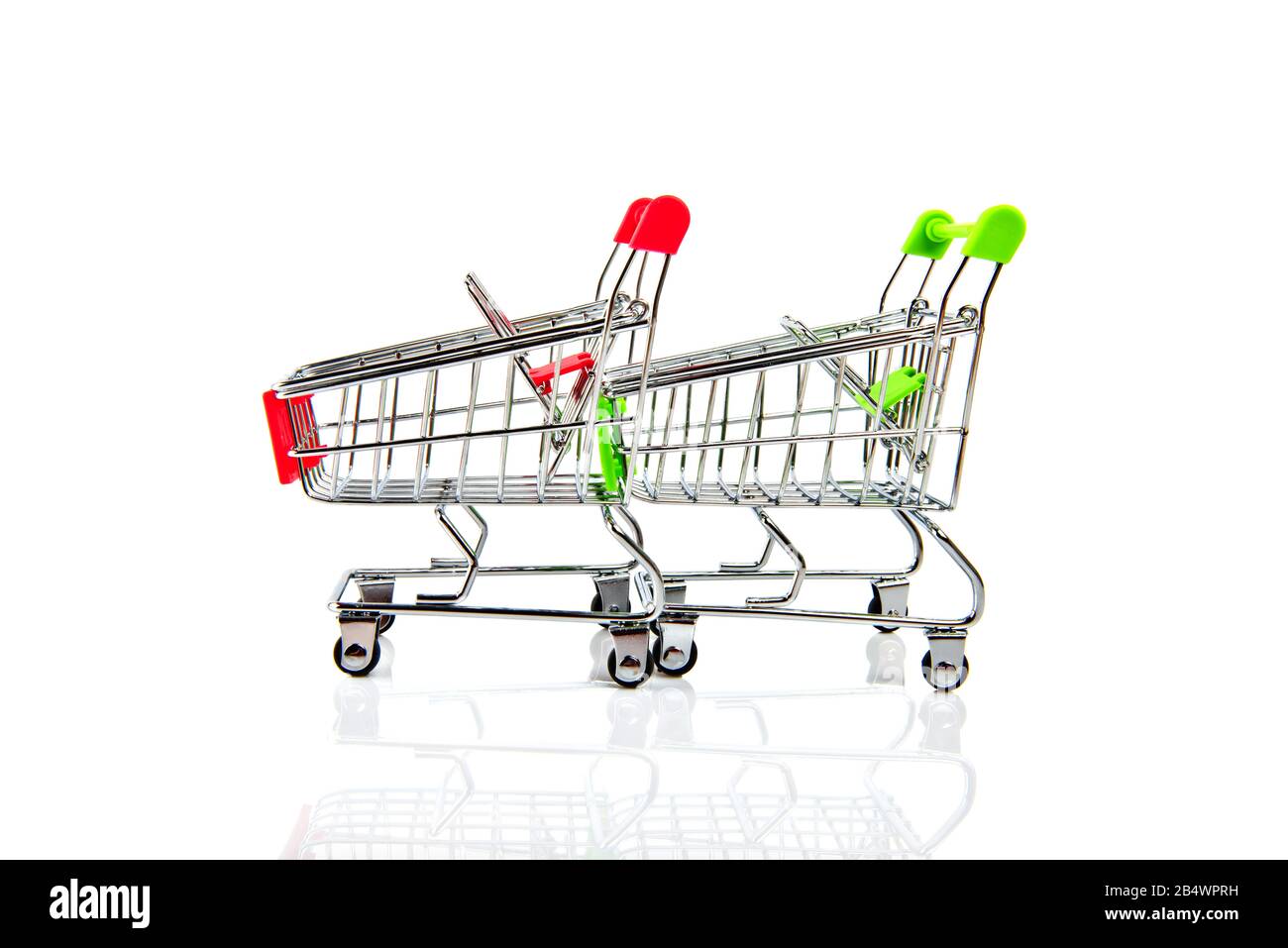 Two empty red and green shopping cart isolated on white background ...