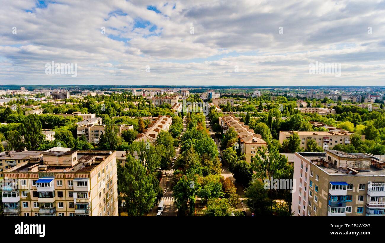 Beautiful view of a typical Ukrainian city surrounded by a green forest ...