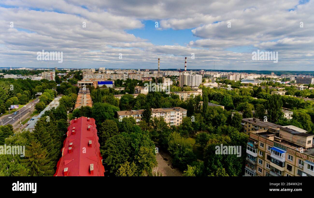 Beautiful view of a typical Ukrainian city surrounded by a green forest ...