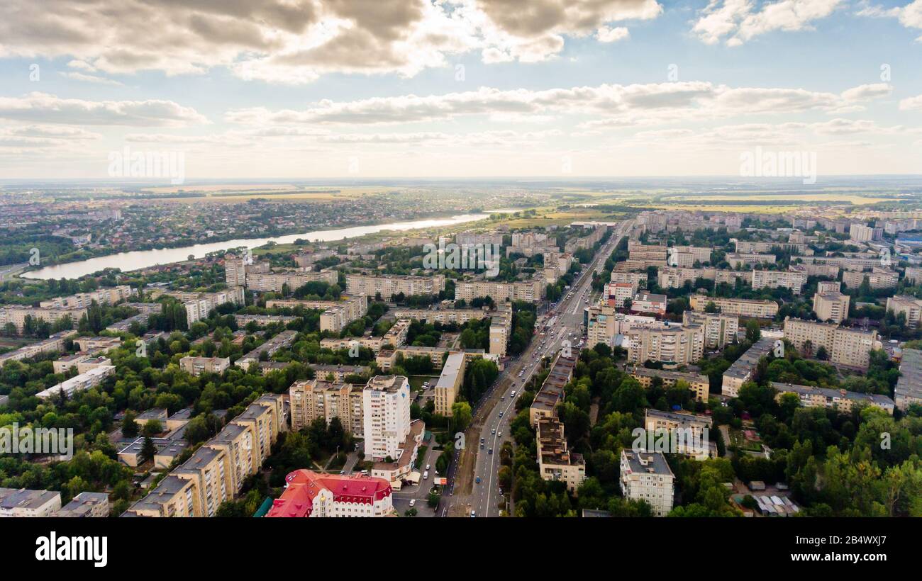Beautiful view of a typical Ukrainian city surrounded by a green forest ...