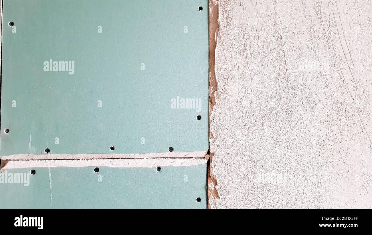Unfinished wall in a building under construction made of plasterboard ...