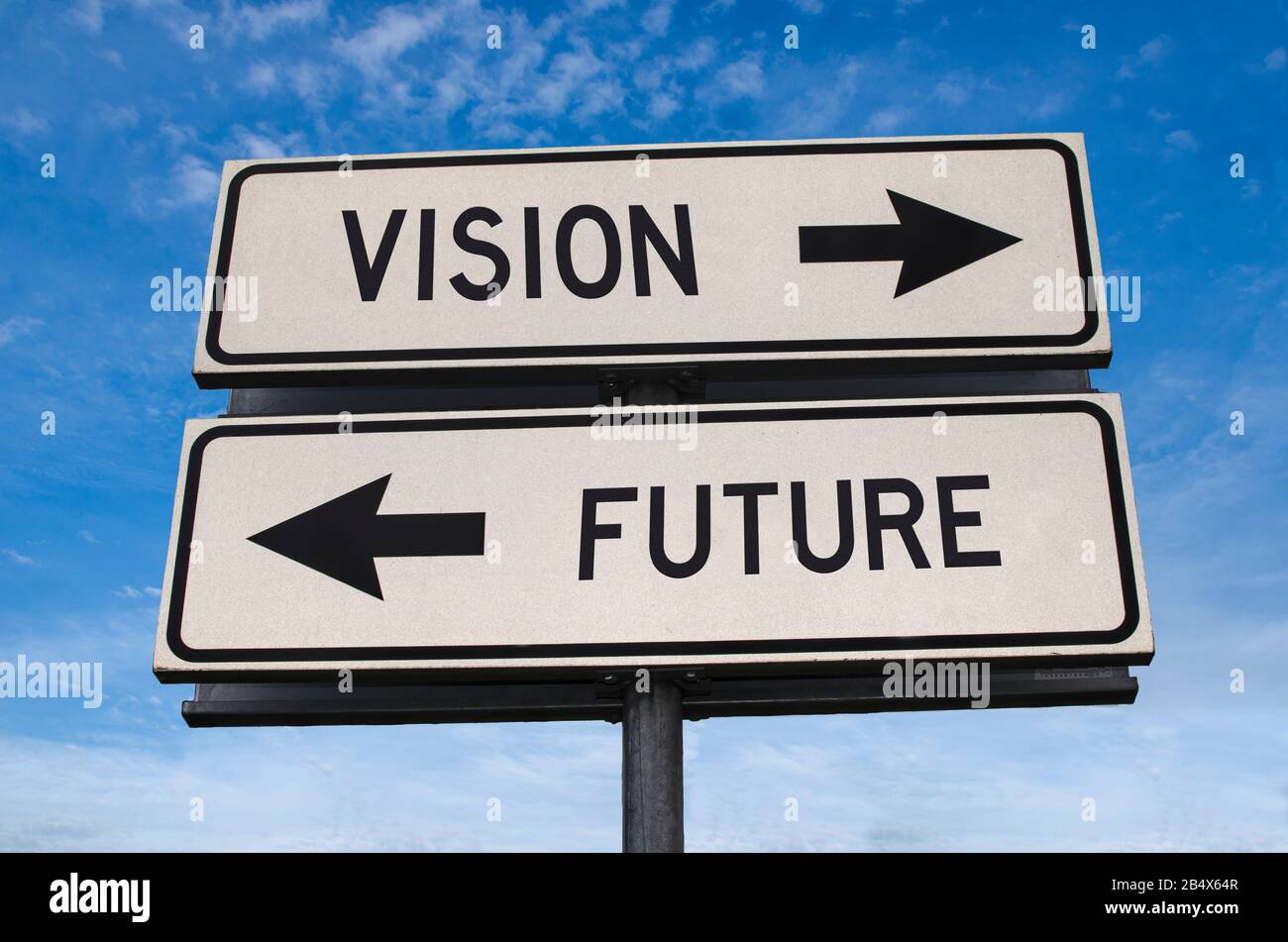 Vision vs future. White two street signs with arrow on metal pole with ...