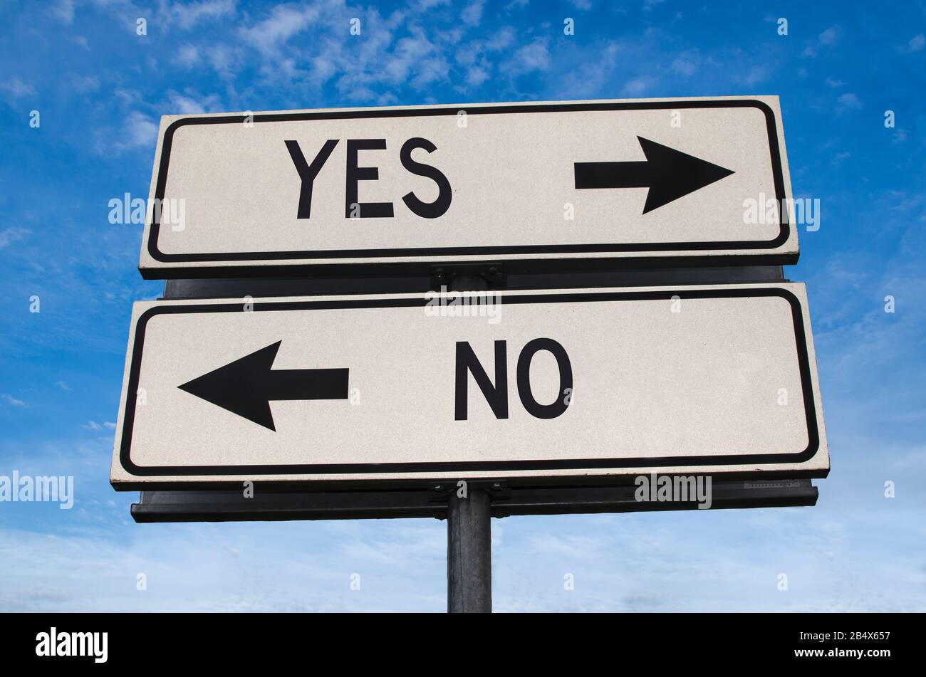 Yes vs no. White two street signs with arrow on metal pole with word ...