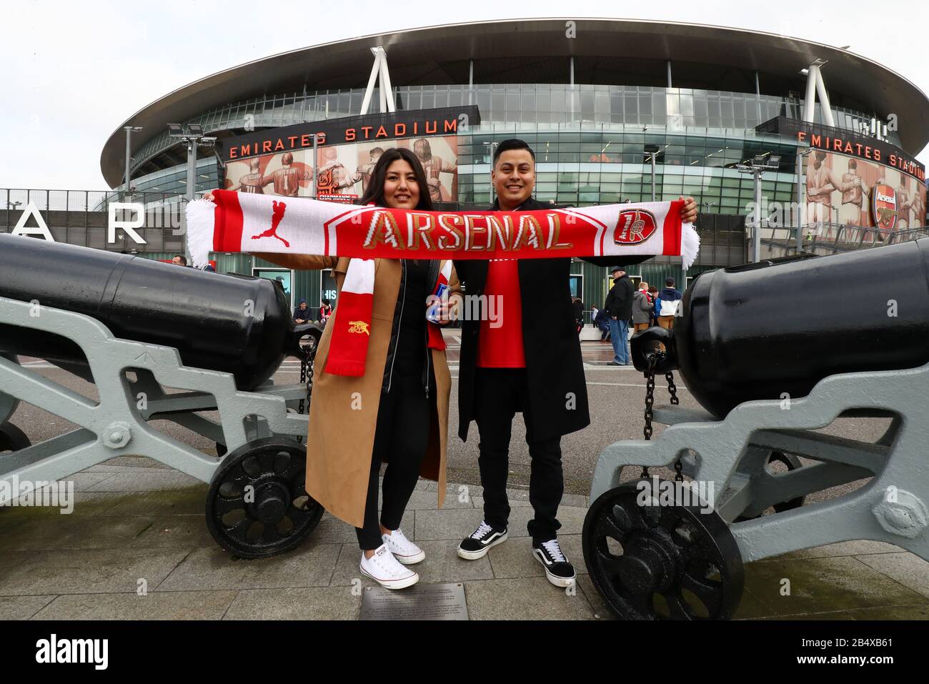 Arsenal fans pose with a scarf during the Premier League match at the ...