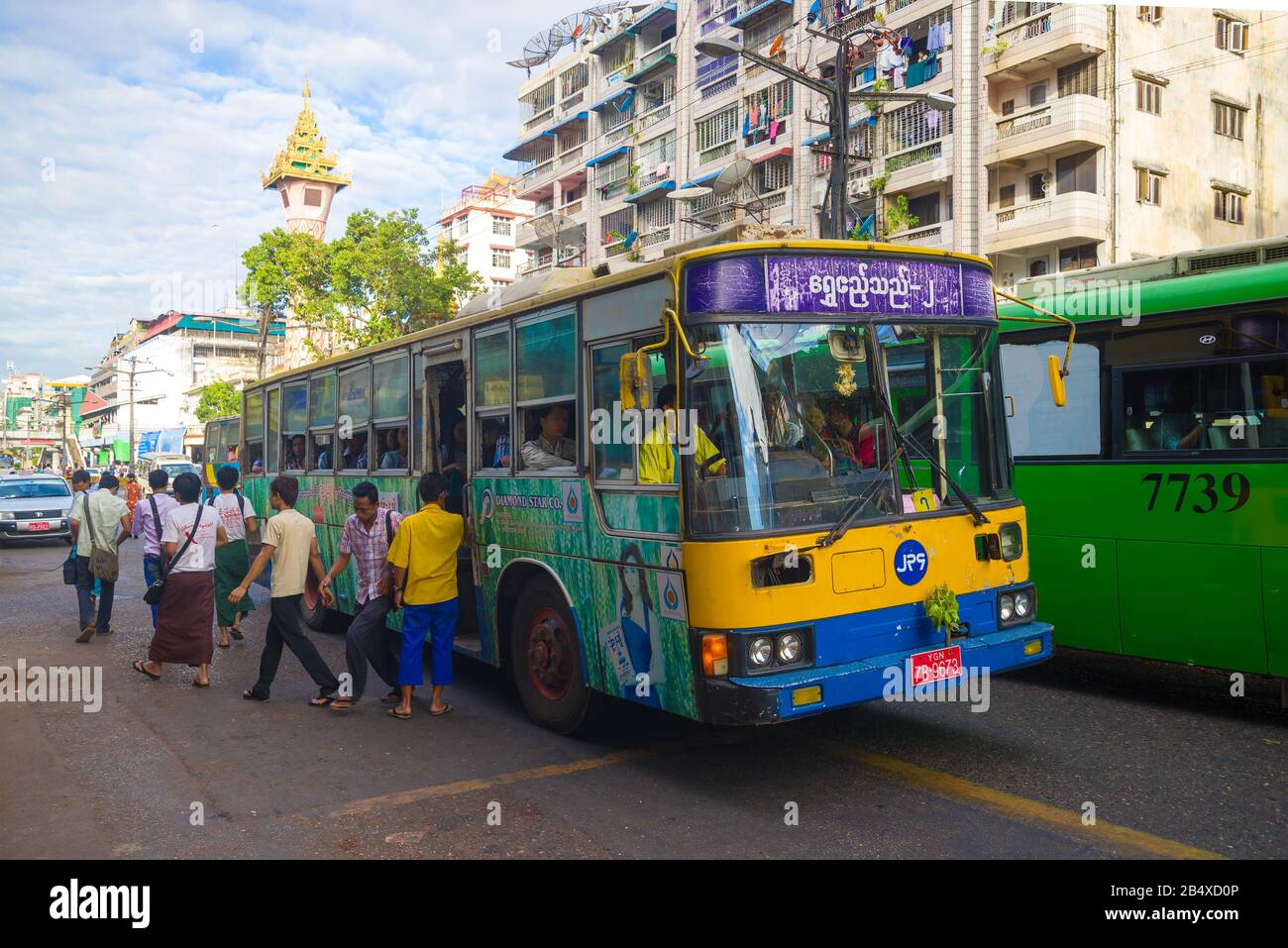 YANGON, MYANMAR - DECEMBER 17, 2016: Passengers get off the shuttle bus ...