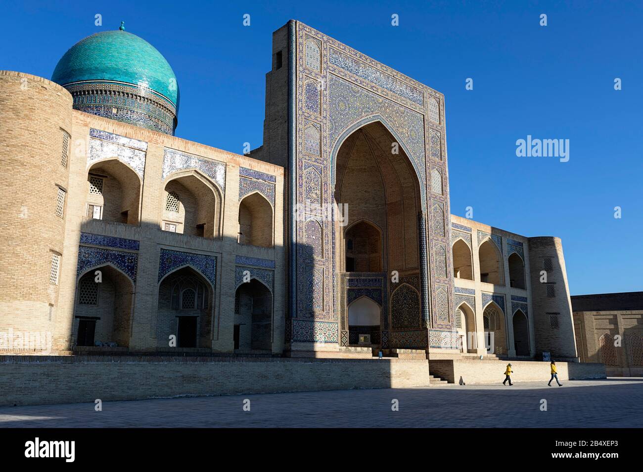 Mother and son in front of Kalyan Mosque, part of the Po-i-Kalyan ...
