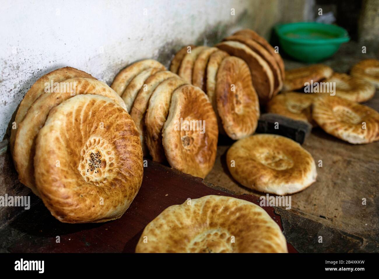 Baking traditional uzbek bread in a small bakery in Bukhara, Uzbekistan ...