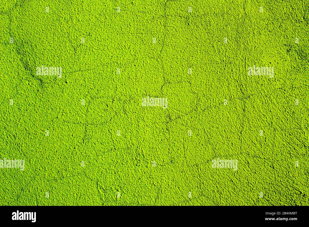 Yellow colored abstract wall background with textures of different ...
