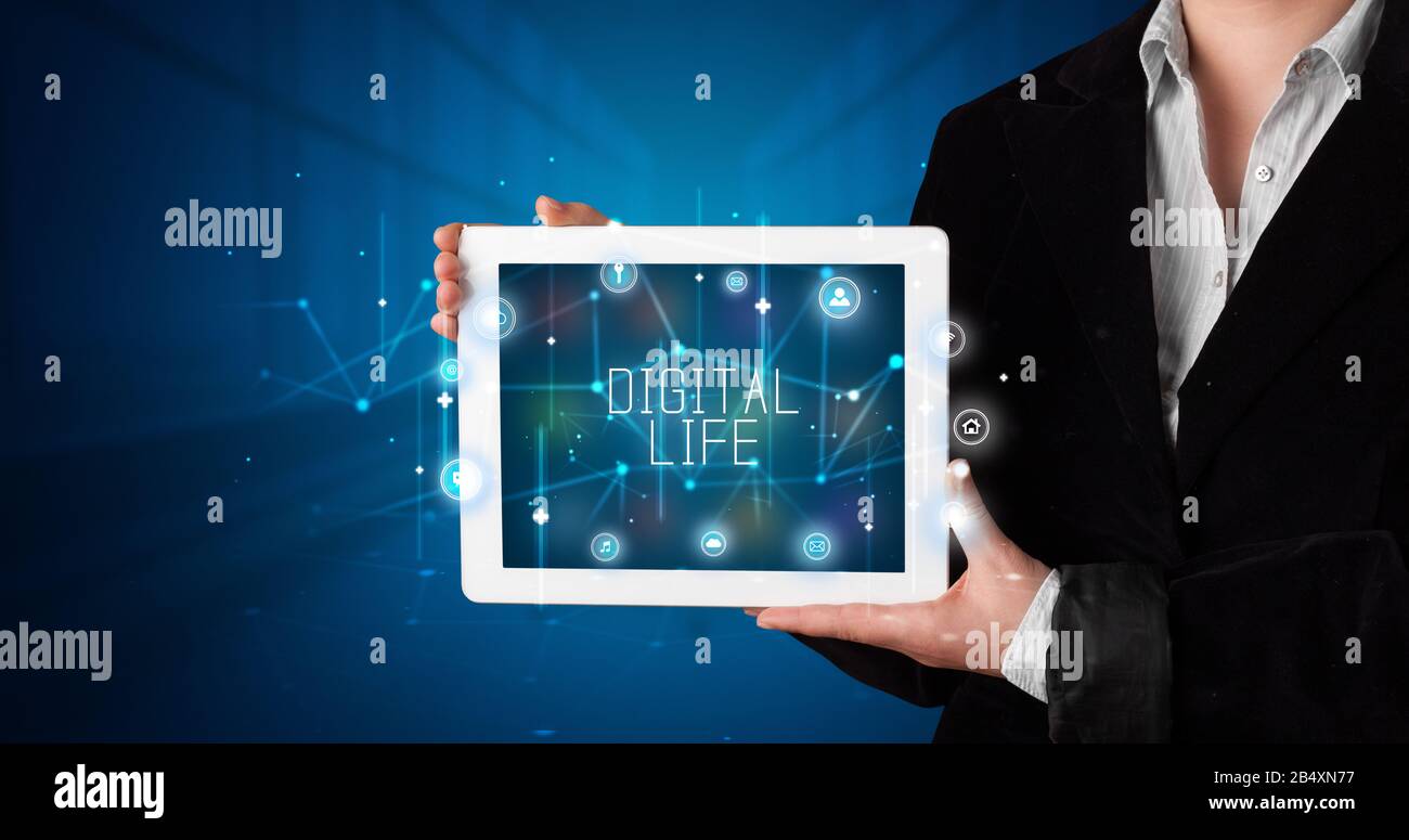 Young business person working on tablet and shows the digital sign ...