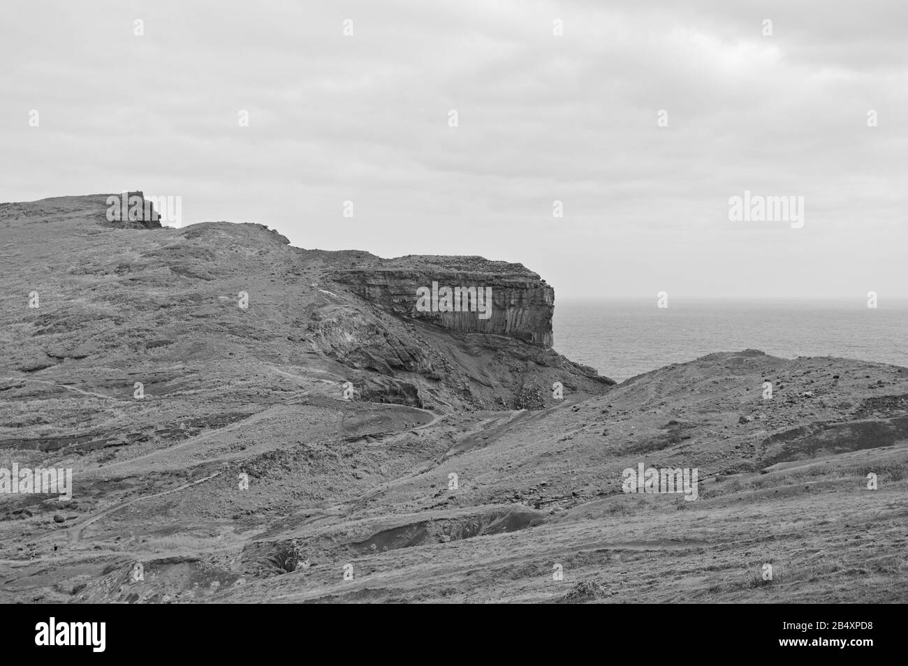 Panoramic view of an arid cliff landscape with trekking pathways in the ...