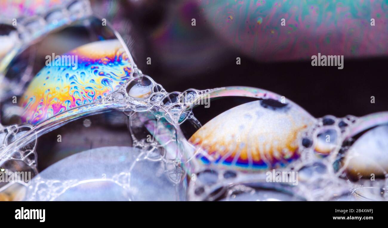 Macro of colorful iridescent soap bubble with abstract patterns and ...