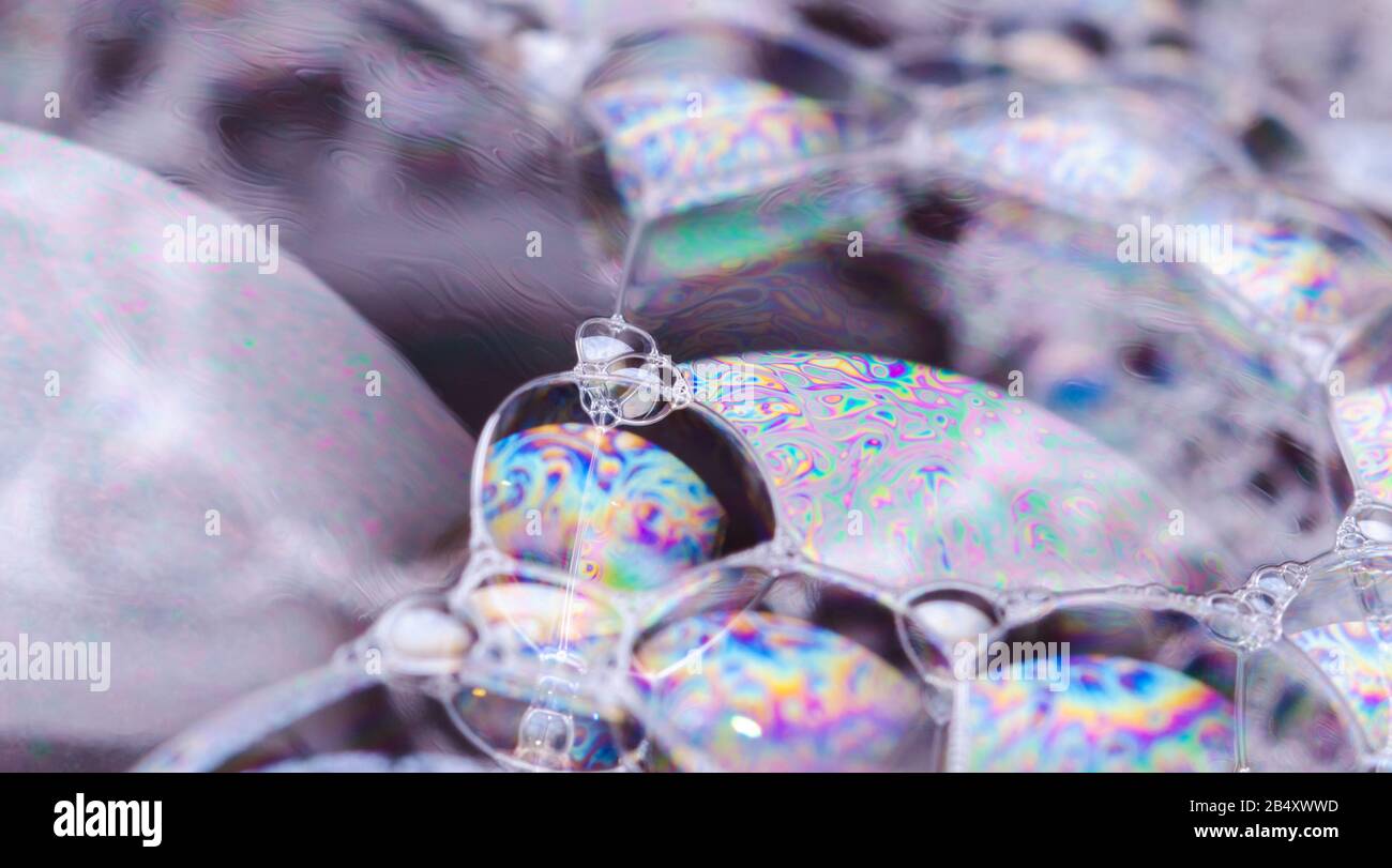 Macro of colorful iridescent soap bubble with abstract patterns and ...