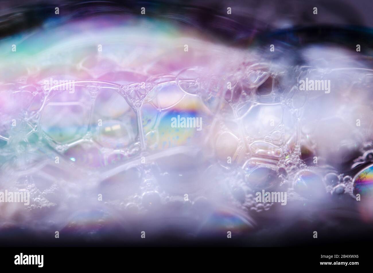 Macro of colorful iridescent soap bubble with abstract patterns and ...