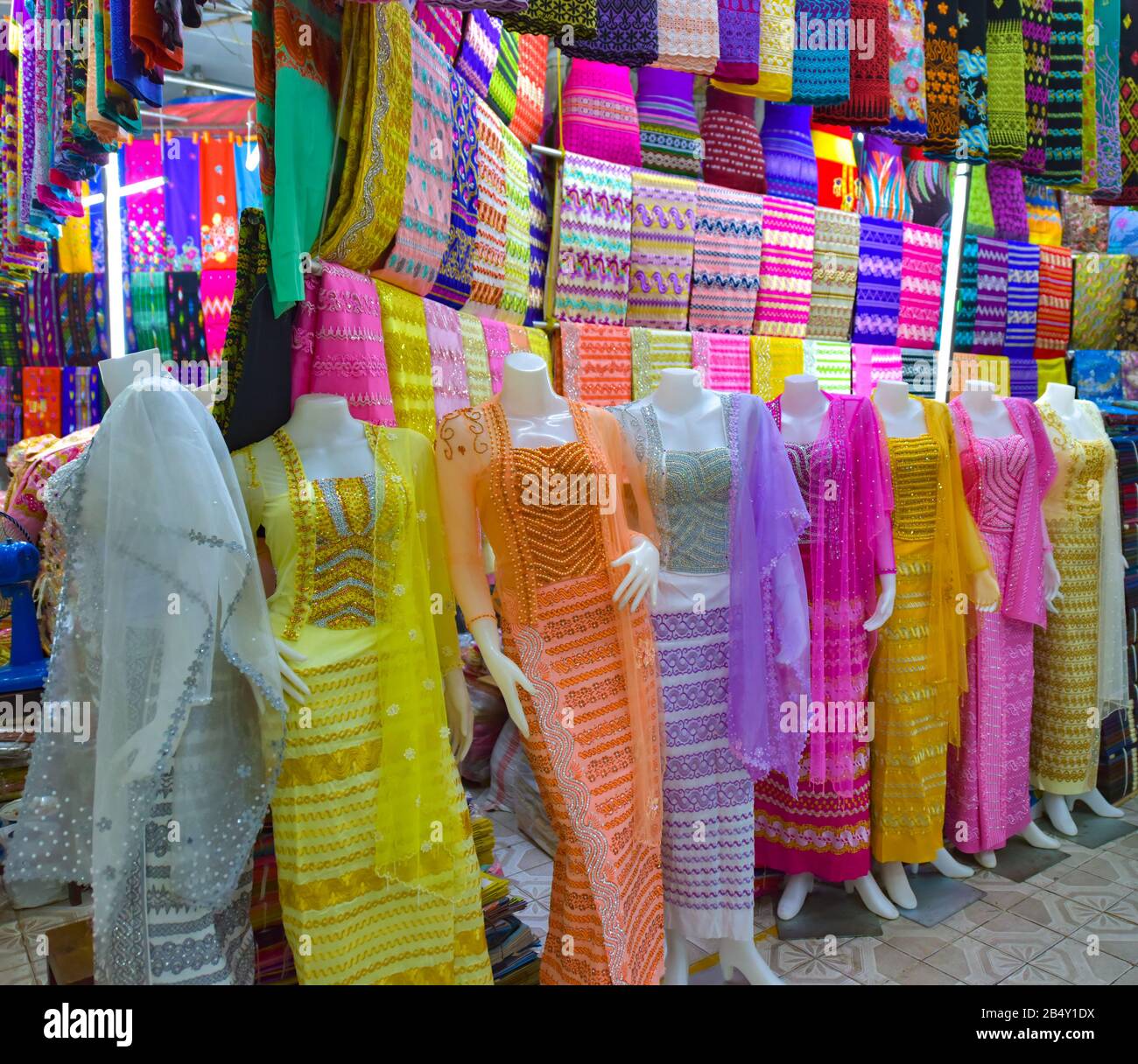 Traditional Asian Burmese dresses and fabrics on display Yangon Myanmar ...