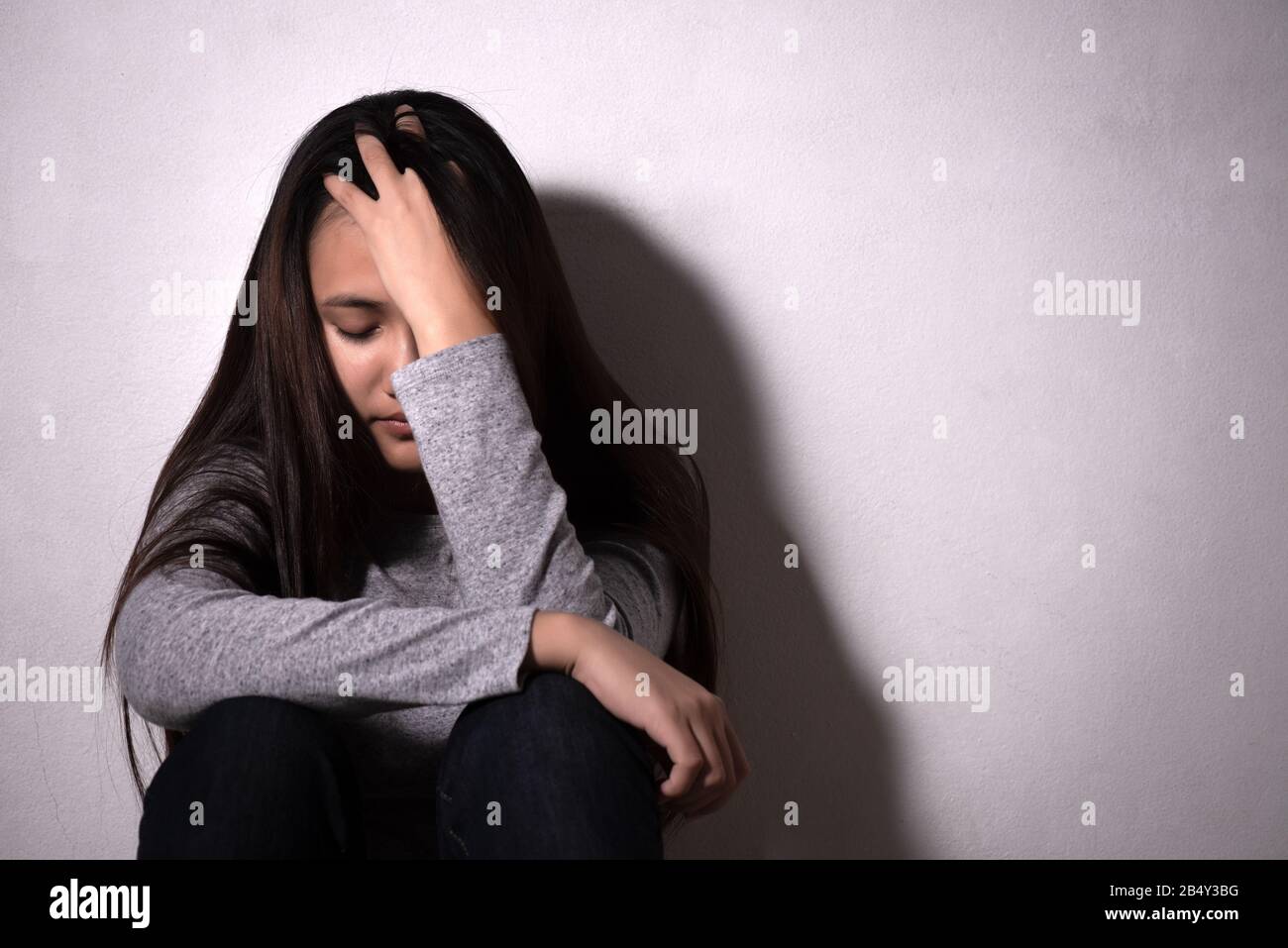Sad Woman Hug Her Knee And Cry Sad Woman Sitting Alone In A Empty Room