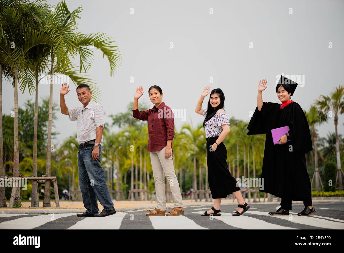 Graduation ceremony. Parents and family congratulate the student, who ...