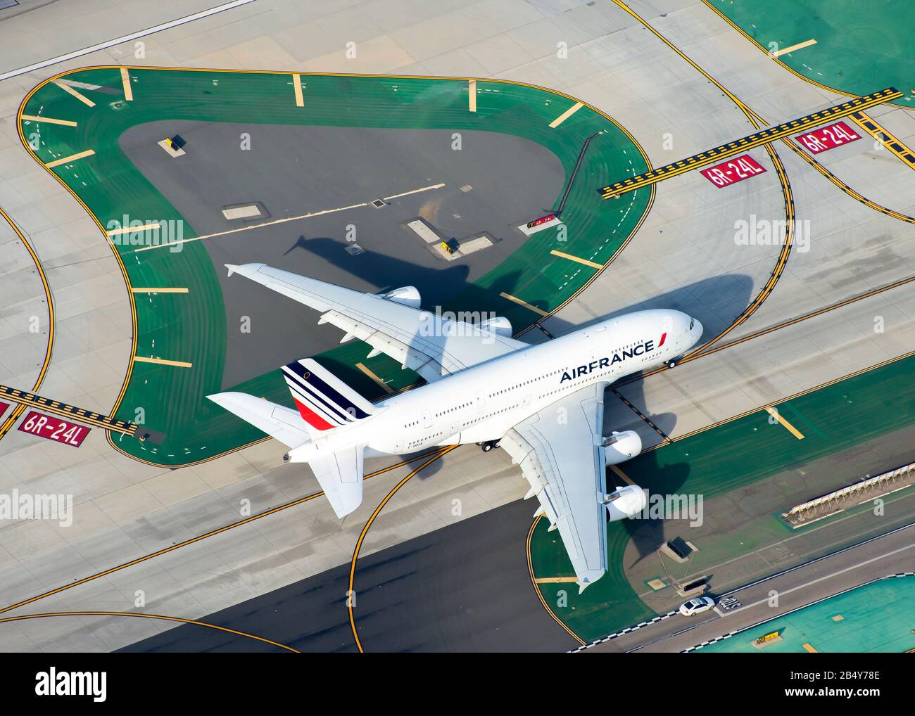 Wide crop aerial view of Air France Airbus A380 with multiple colorful ...