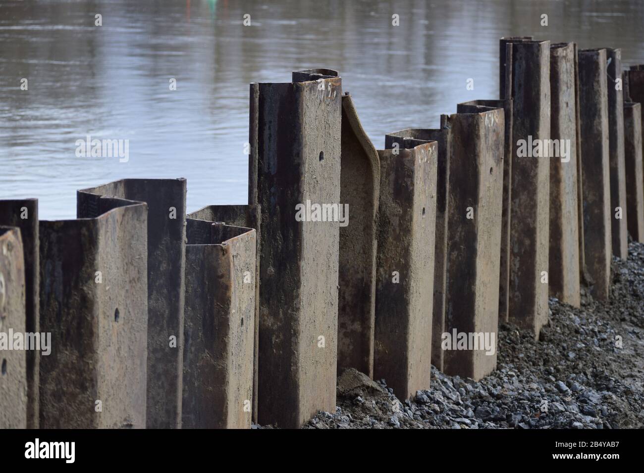 Water protection barrier made of Steel supports Stock Photo - Alamy
