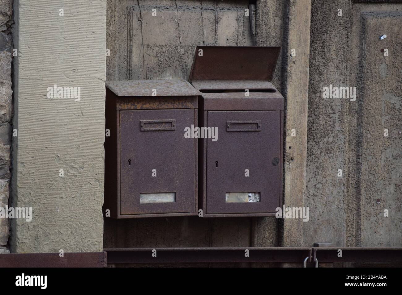 two rusted Double mailboxes - one opened Stock Photo - Alamy
